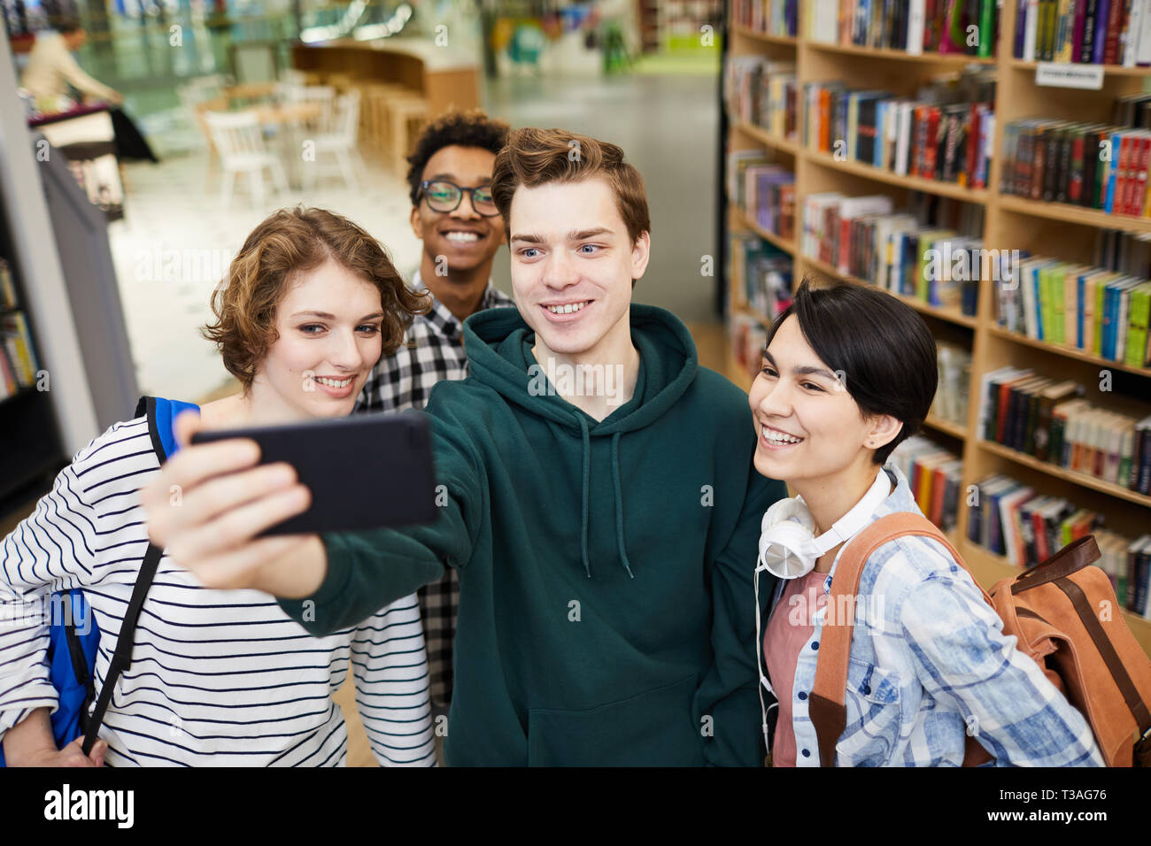 Selfie of students in book store Stock Photo - Alamy