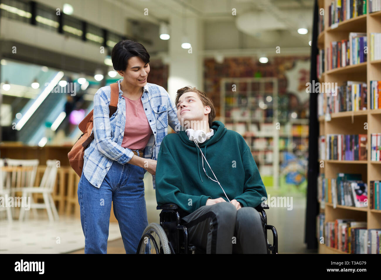 Taking care of disabled student Stock Photo - Alamy