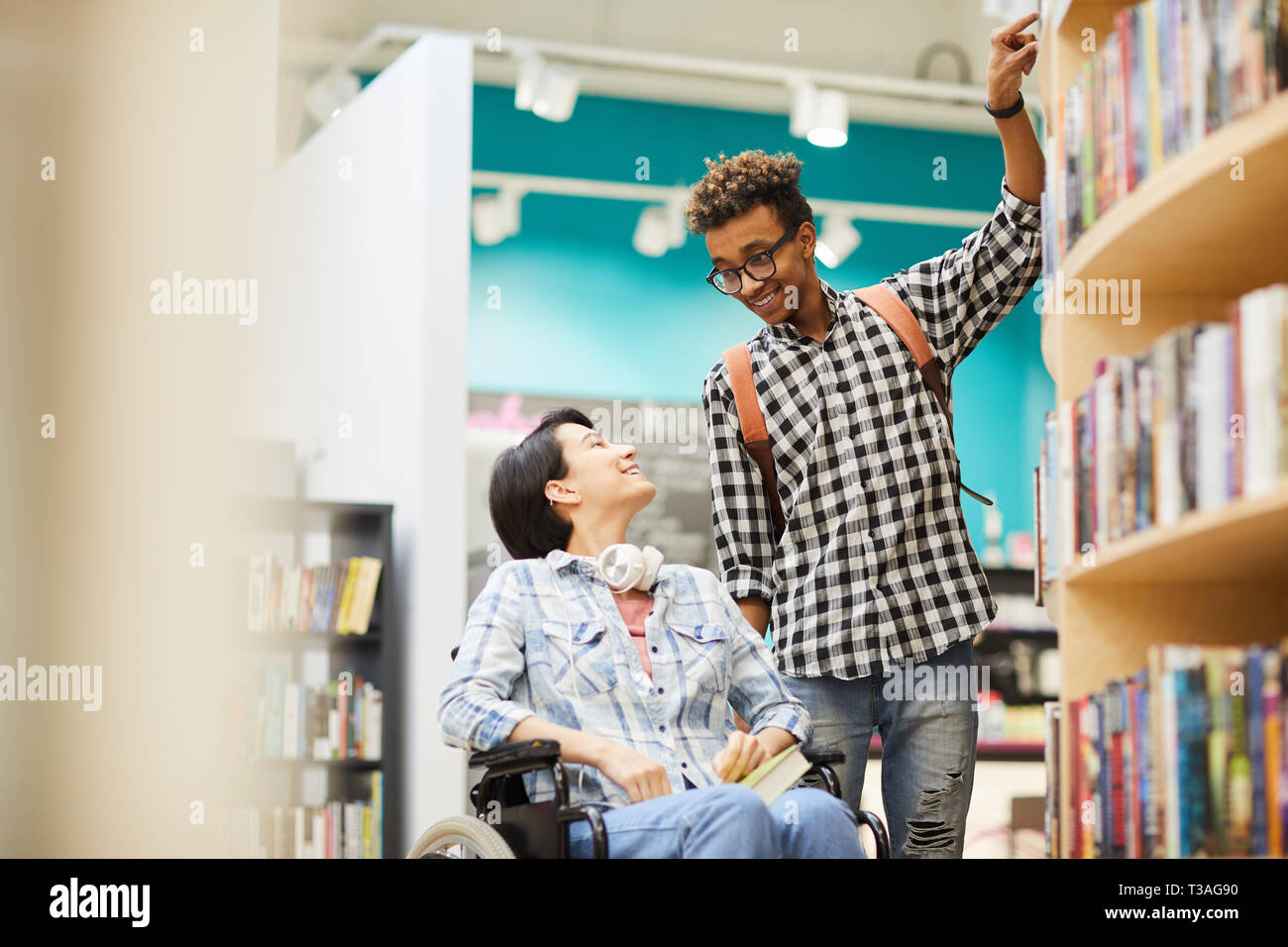 Helping disabled student girl Stock Photo - Alamy