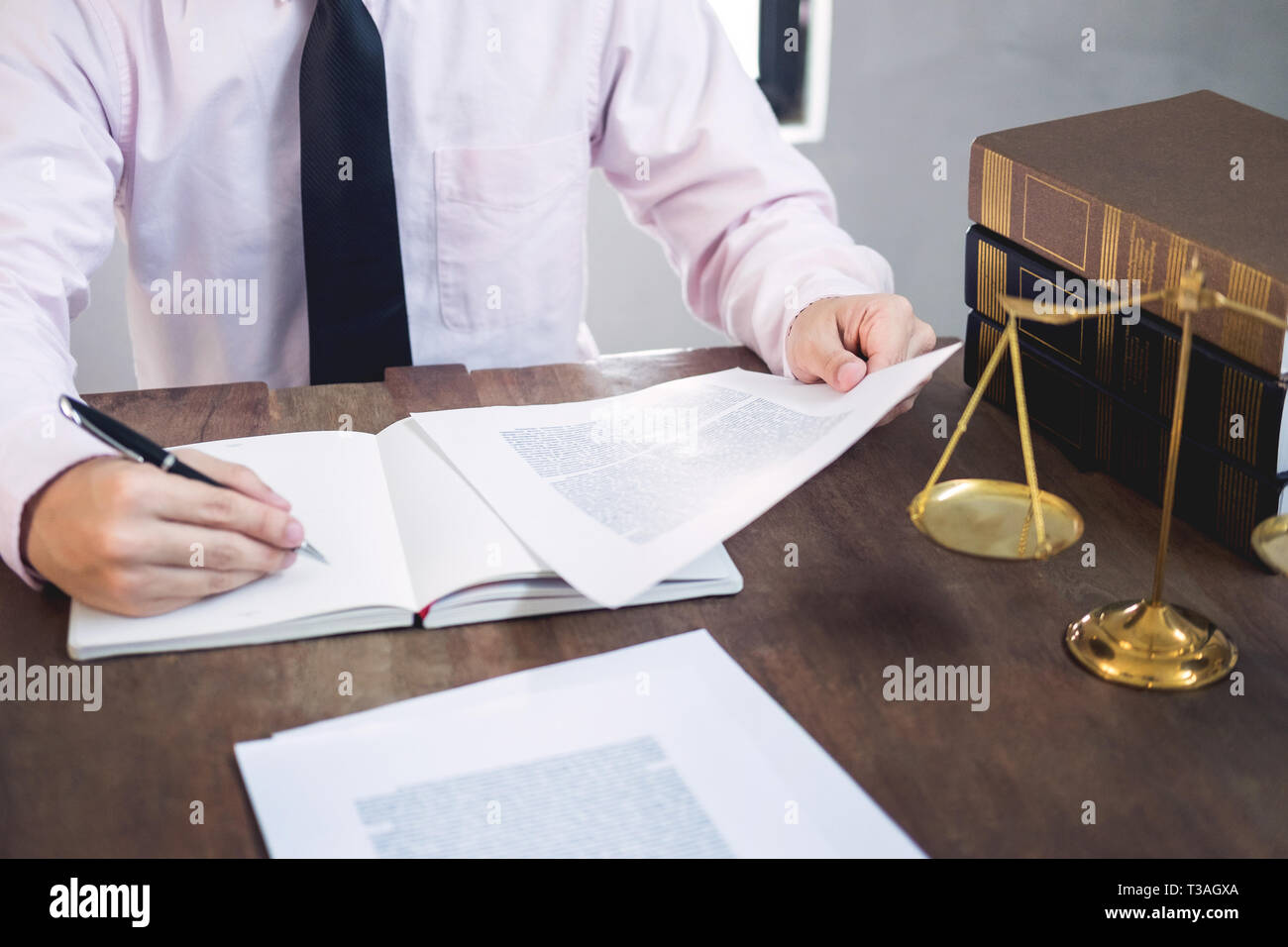 lawyer judge reading documents at desk in courtroom working on wooden ...