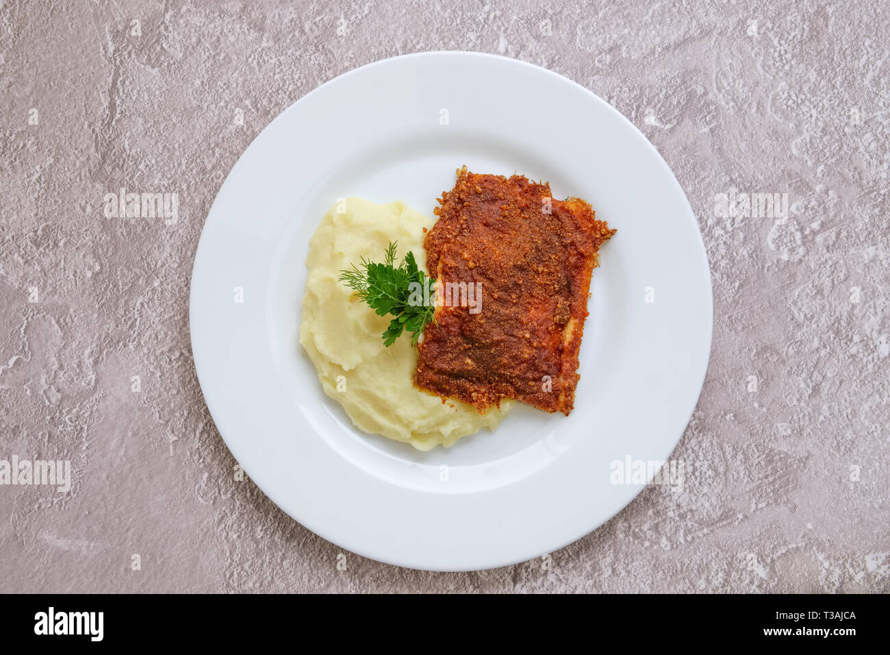 Fried hake fillet with spinach, cheese and rice Stock Photo - Alamy