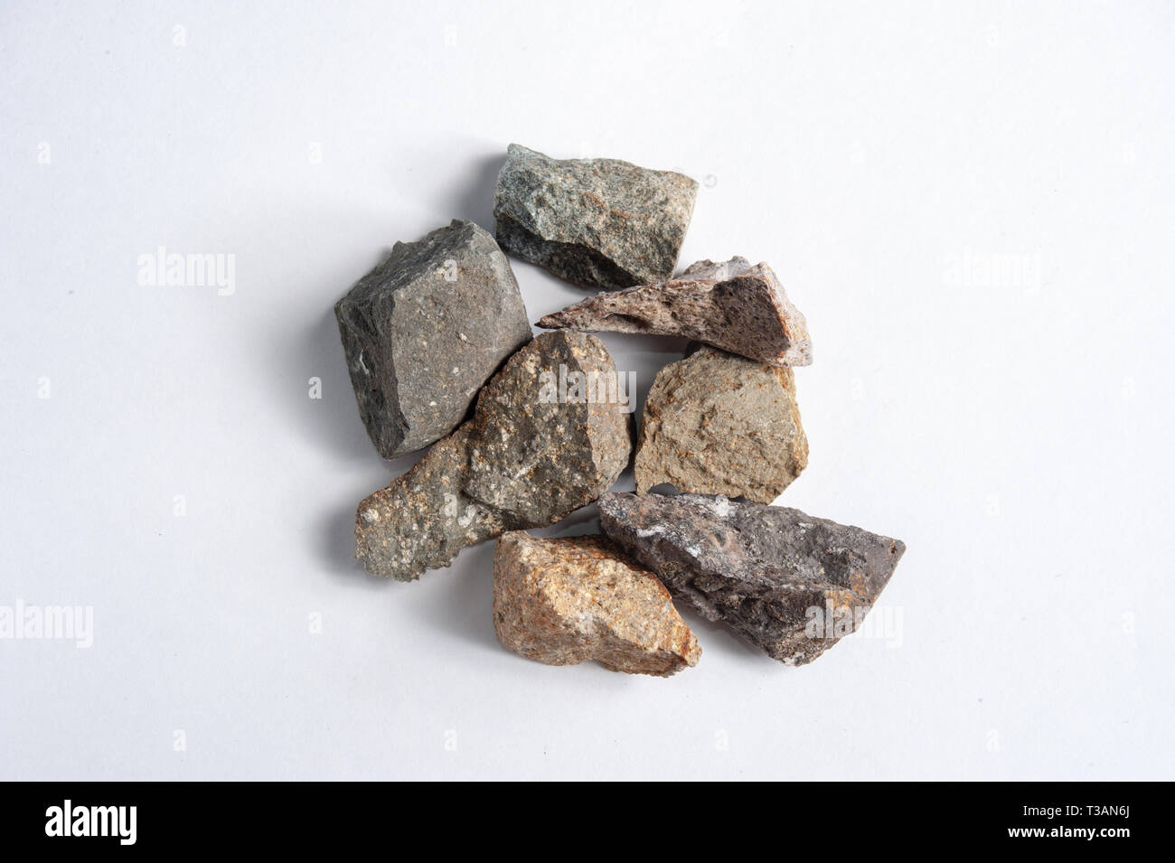 multi color rock isolated on white background Stock Photo - Alamy