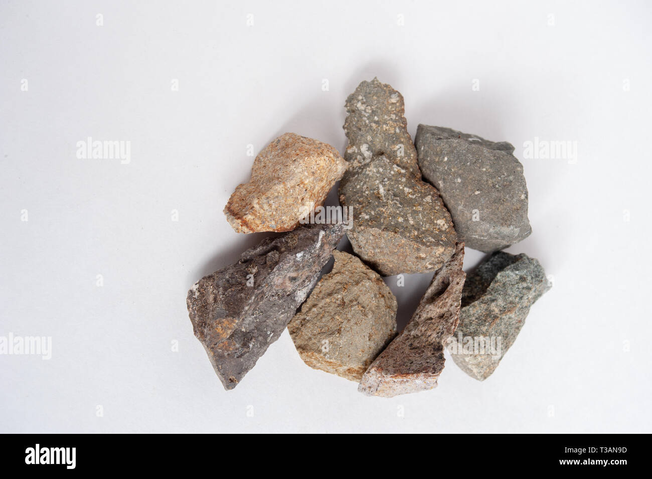 multi color rock isolated on white background Stock Photo - Alamy