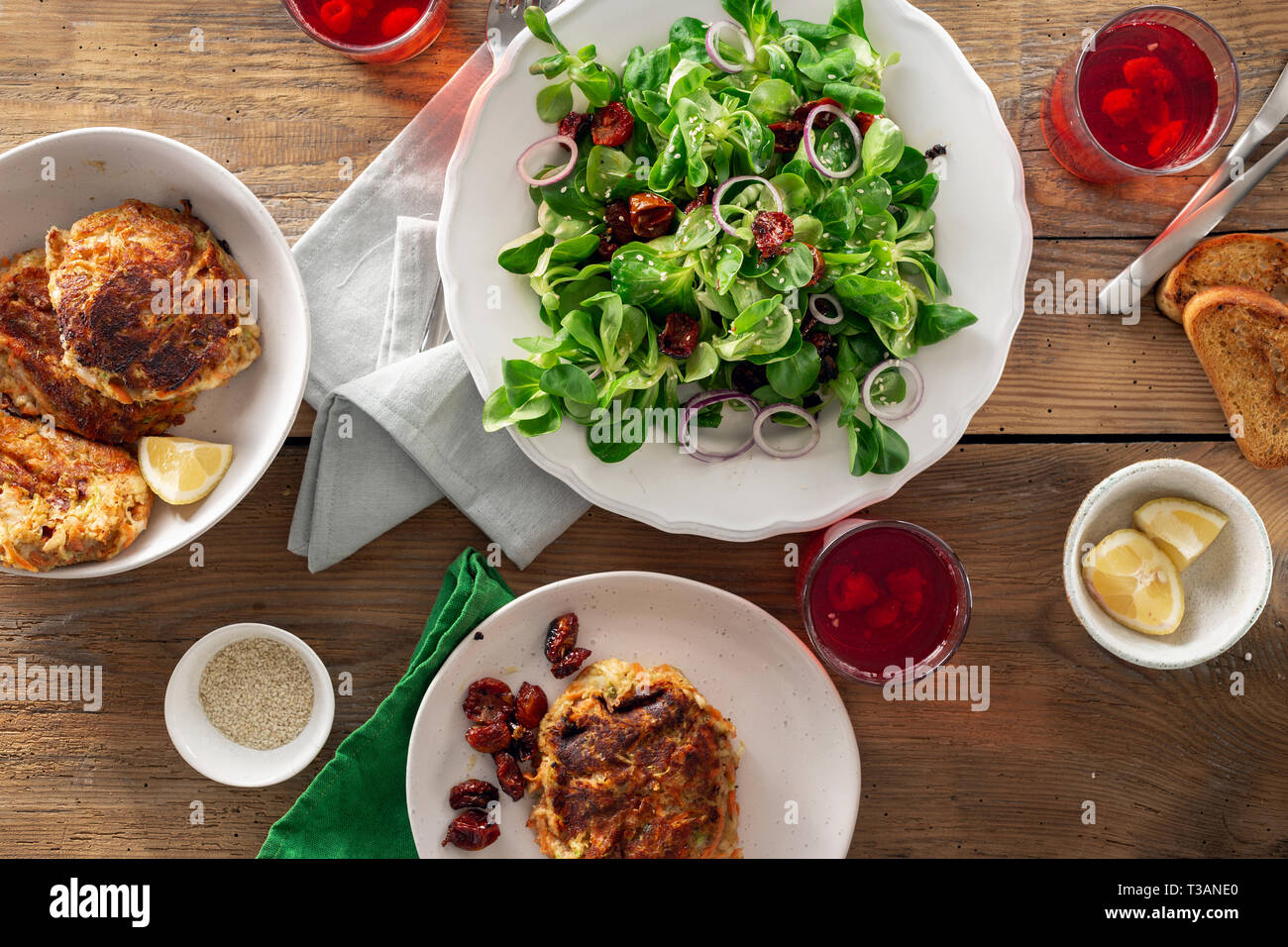 Healthy food concept. Vegetarian dinner table with green salad and ...