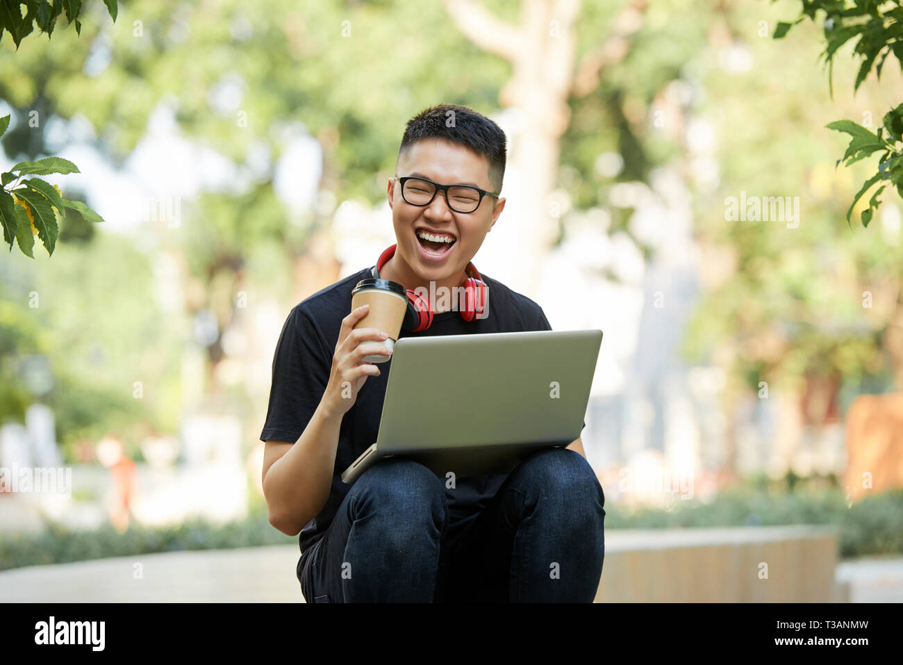 Happy student on campus Stock Photo - Alamy