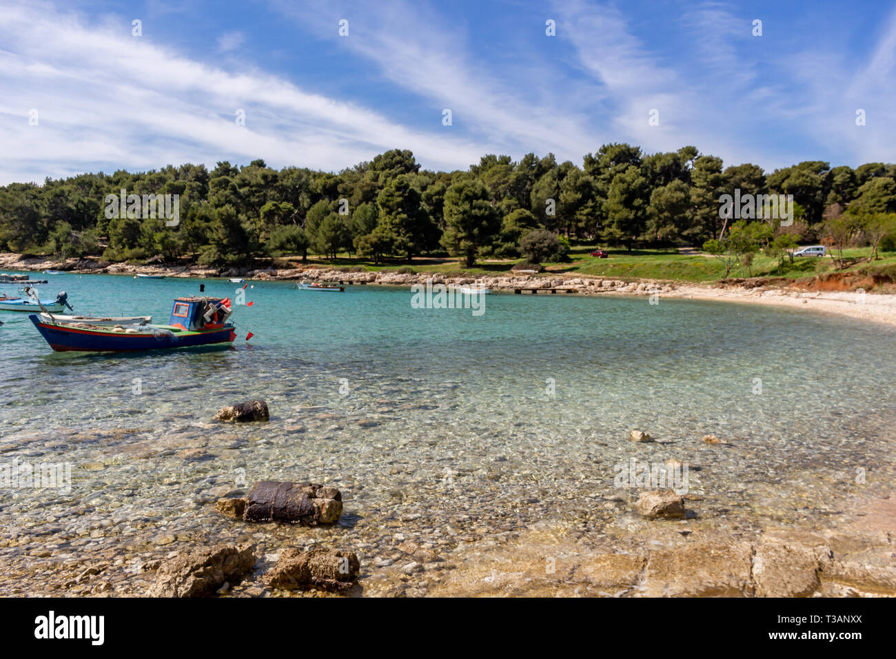 Fishing boats parked in a bay with transparent waters in Stoja near ...
