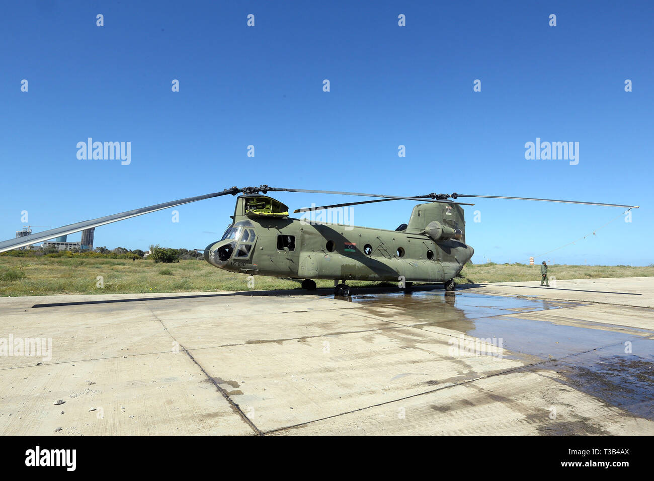 Tripoli, Libya. 08th Apr, 2019. A military transport helicopter lies on ...