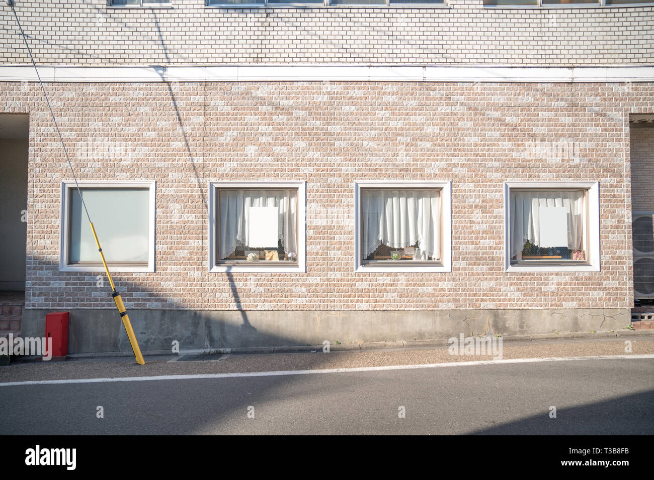 pastel creamy brick wall with window and curtain Stock Photo - Alamy