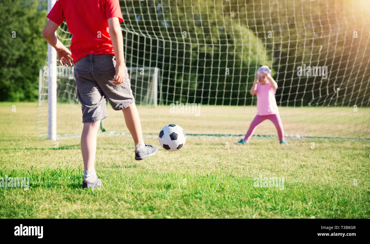 Boys play football on field hi-res stock photography and images - Alamy