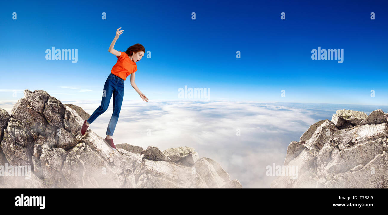Woman stumbled on the rocks and going to falls down Stock Photo - Alamy