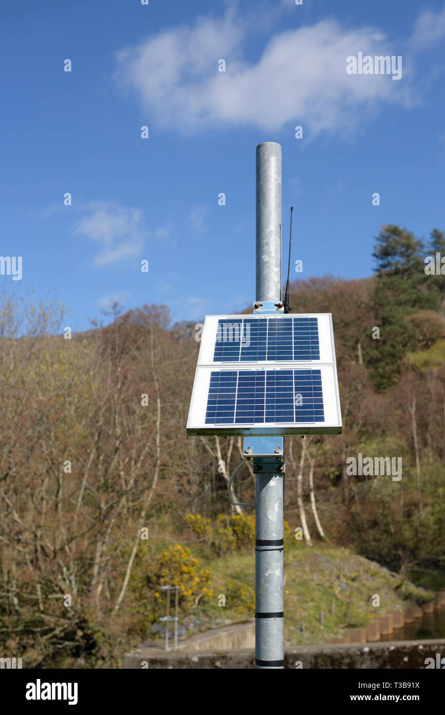 Photovoltaic panel, solar panel, solar cells on metal post with foliage ...