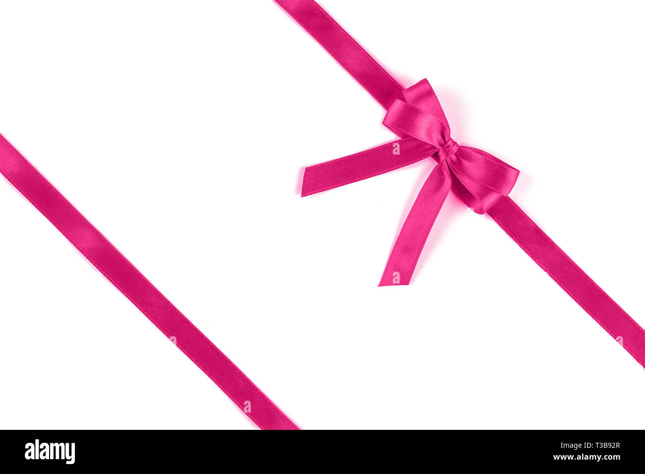 Shiny pink silk ribbon on white background Stock Photo - Alamy
