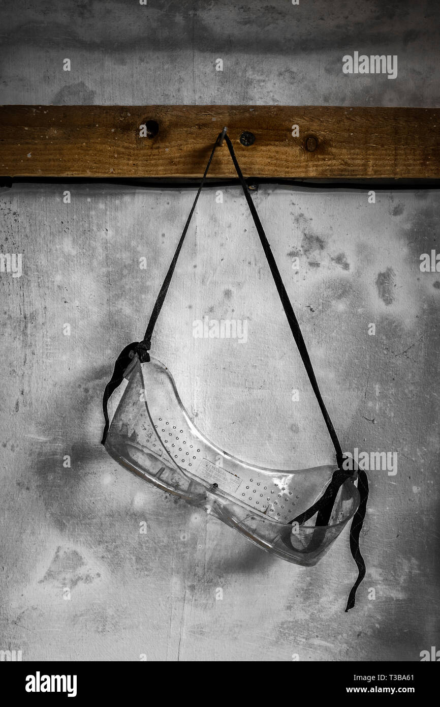 Safety goggleshanging in a workshop Stock Photo - Alamy