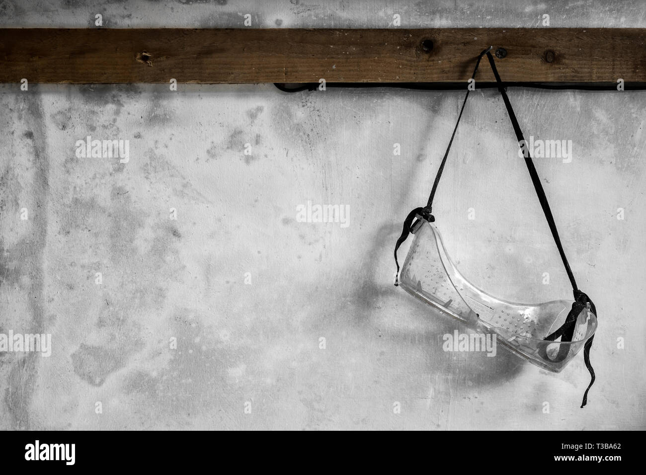 Safety goggleshanging in a workshop Stock Photo - Alamy