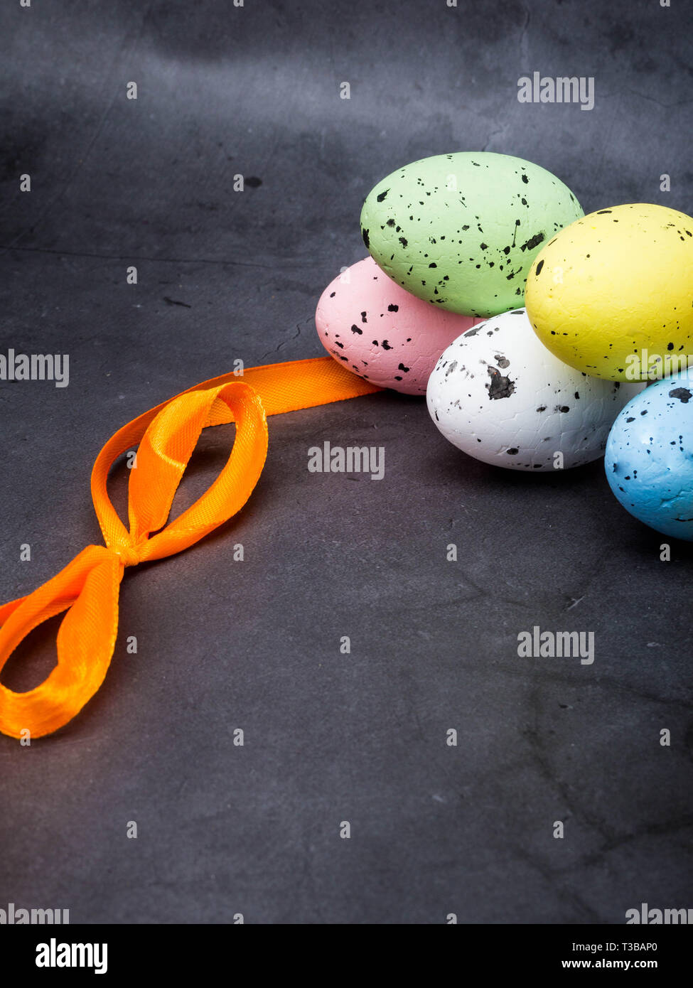 Easter composition with colorful eggs on grey concrete background ...