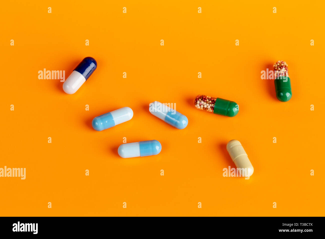 Blue and green medicine capsules Stock Photo - Alamy