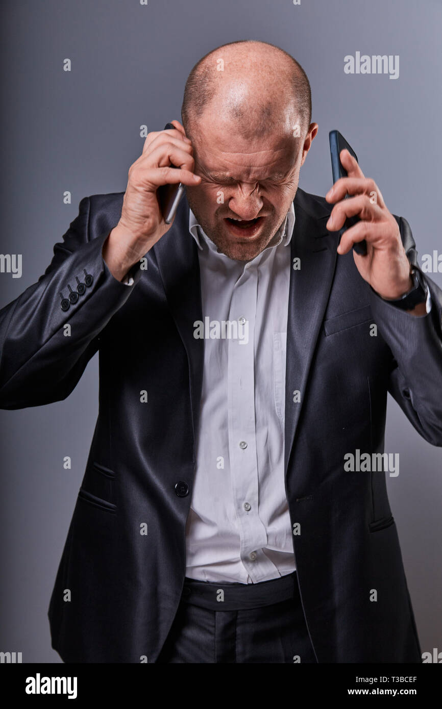 Unhappy loud crying angry business man talking on mobile phone very ...