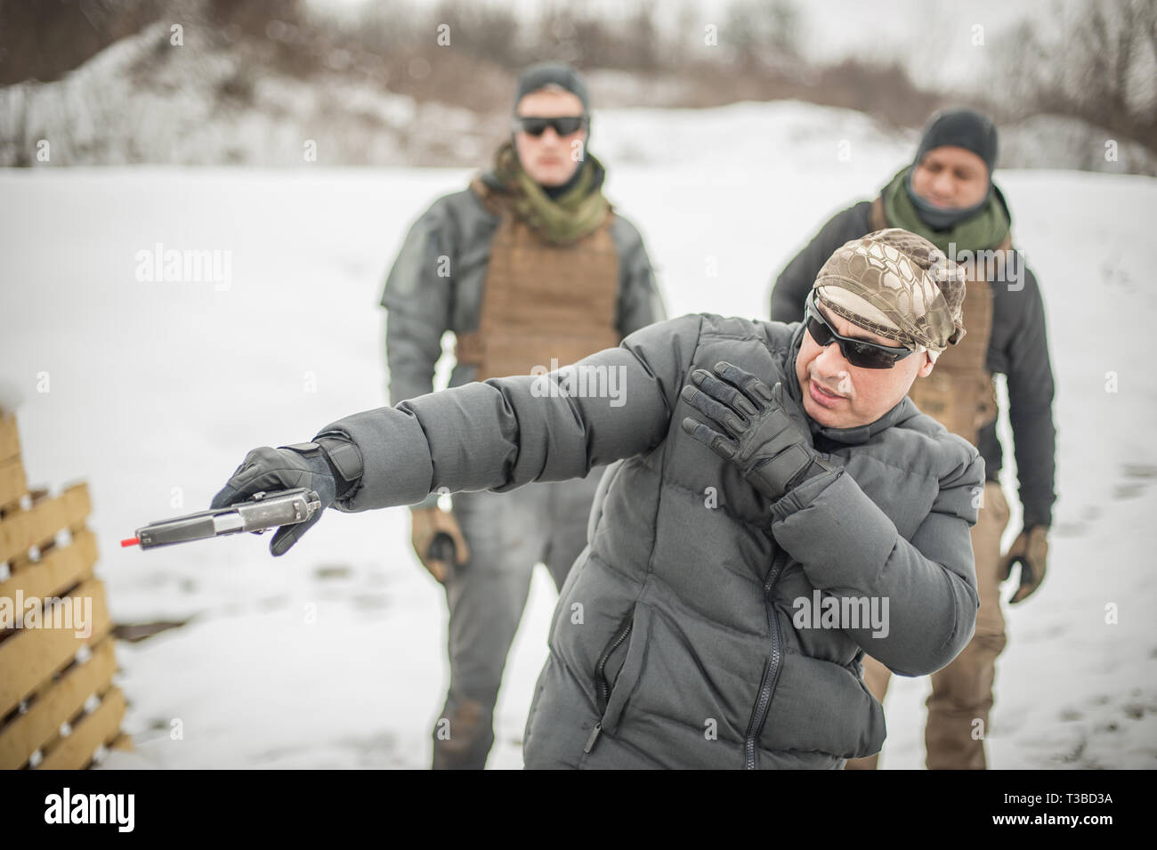 Instructor demonstrate action combat tactical gun shooting to his ...