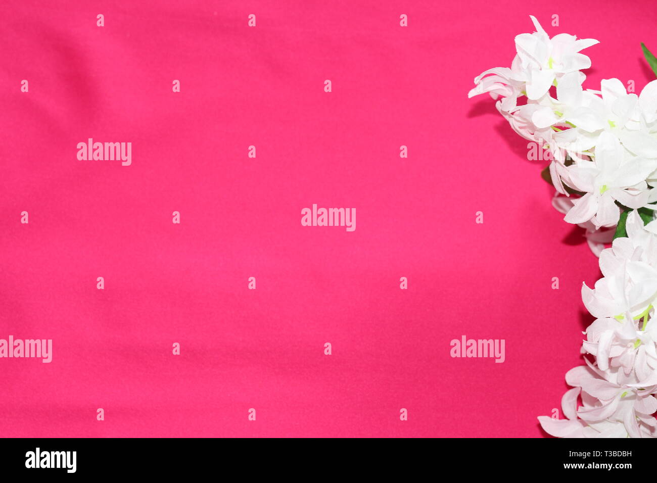 The texture of silk fabric. The material is pink-red. Close-up. There ...