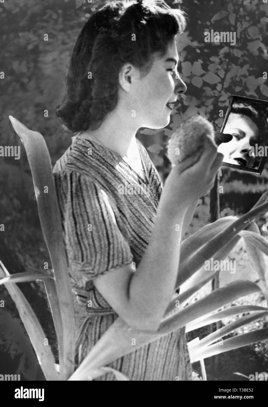 Woman looking in the mirror Black and White Stock Photos & Images - Alamy