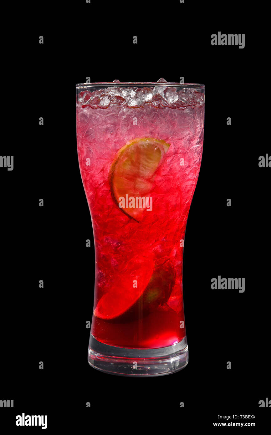 A single-colored, red pink cocktail in a tall glass with fine ice and ...