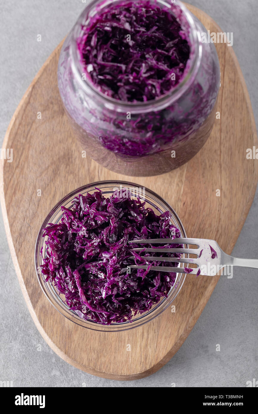 Homemade fermented cabbage. Vegan salad rustic style glass jar. Concept ...