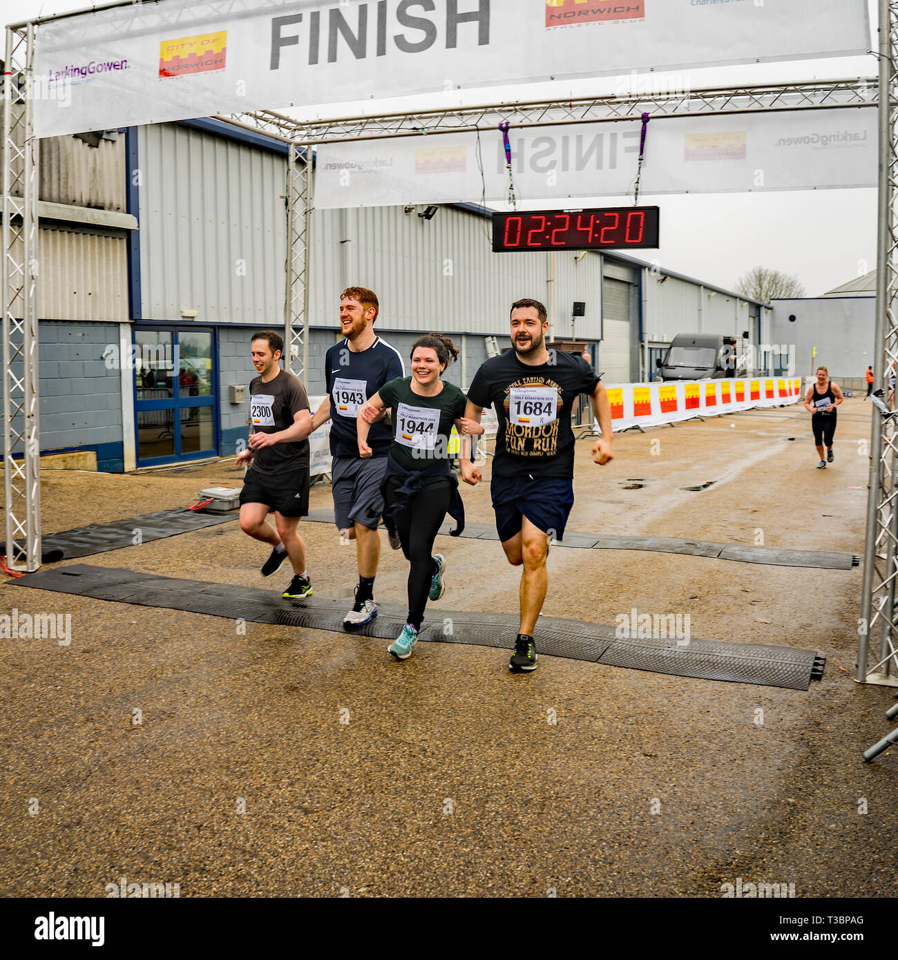 Runners crossing the finish line in a race hi-res stock photography and ...