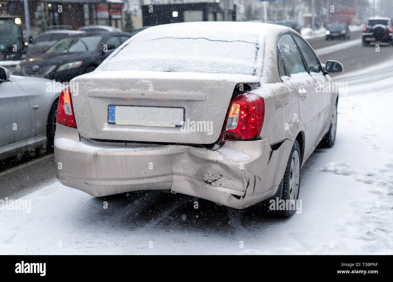 Winter car accident on the road in winter city Stock Photo - Alamy