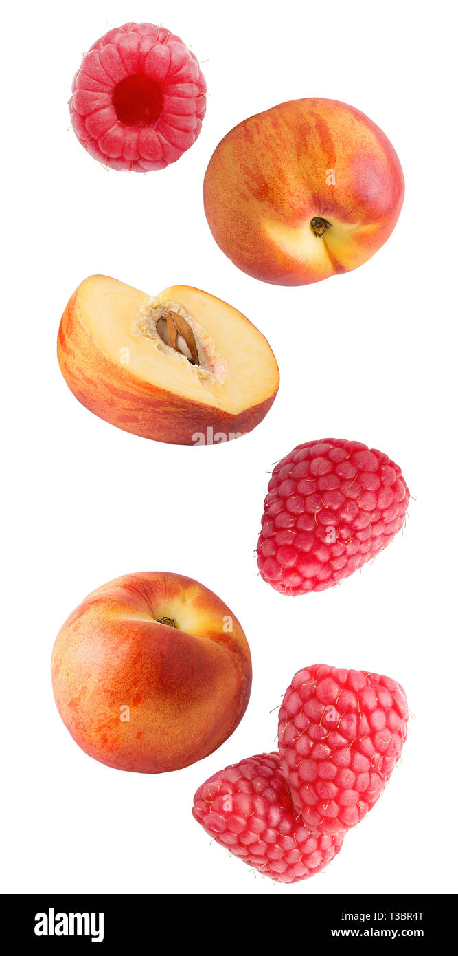 Flying peach and raspberry fruits isolated on white background with ...