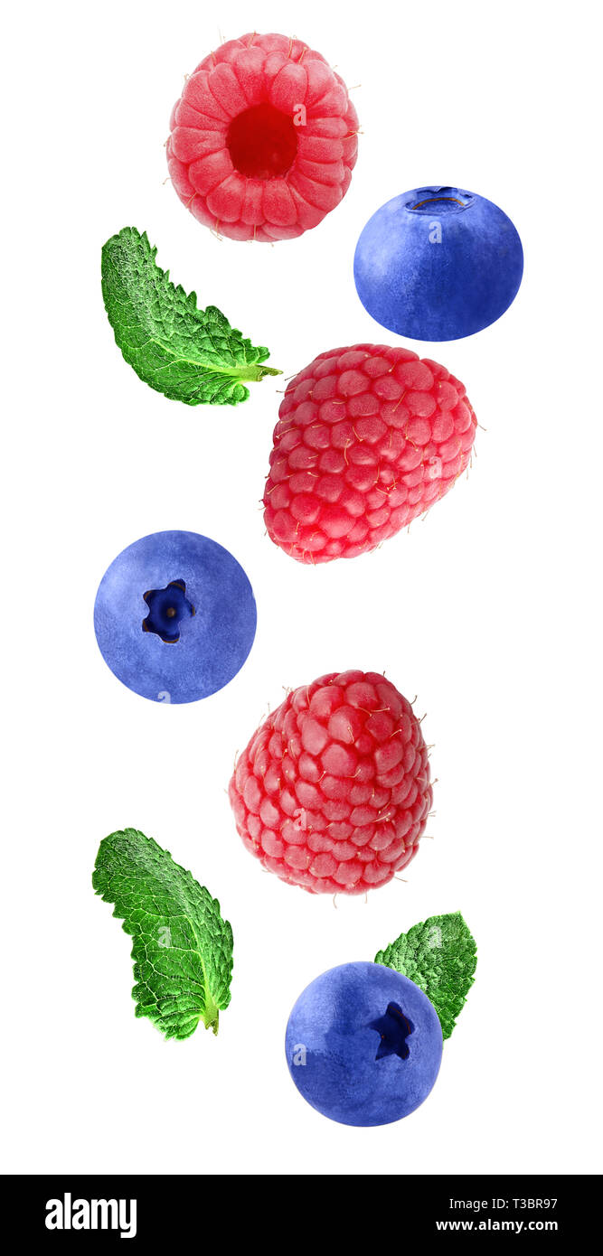Flying raspberry and blueberry fruits isolated on white background with ...