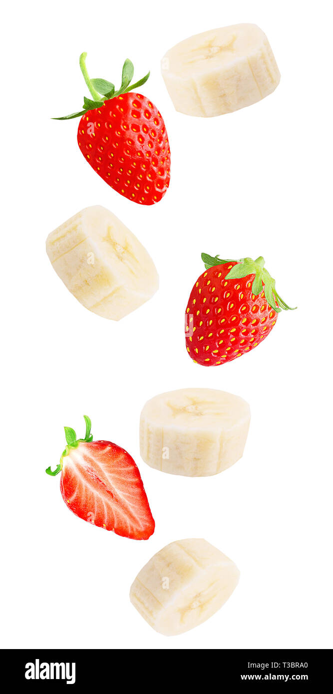Flying slice banana and strawberry fruits isolated on white background ...