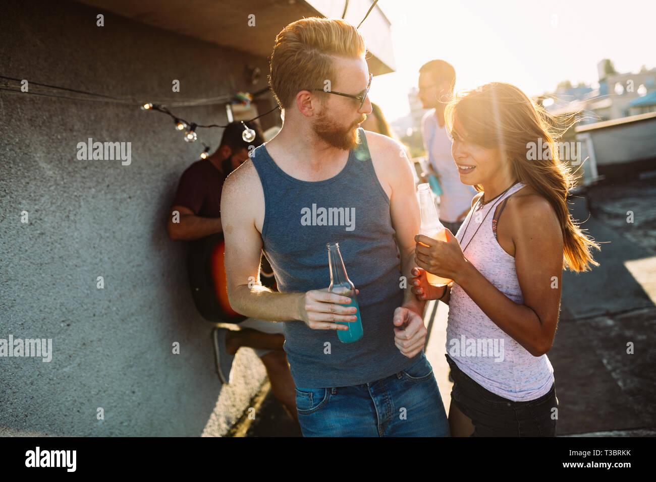 Happy couple having fun time at party Stock Photo - Alamy