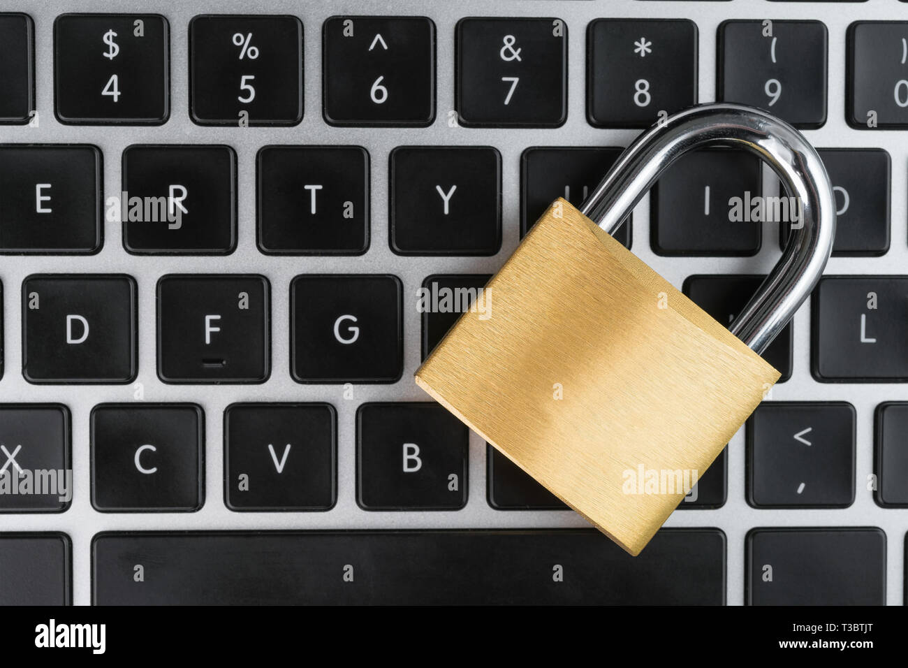 Padlock on a laptop computer keyboard. Cyber security abstract concept ...