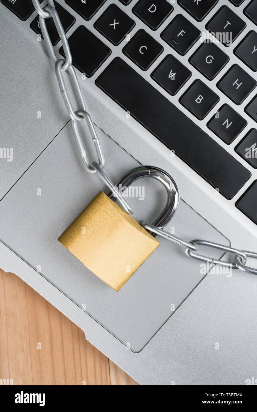 Padlock with chain on a laptop computer keyboard. Cyber security ...