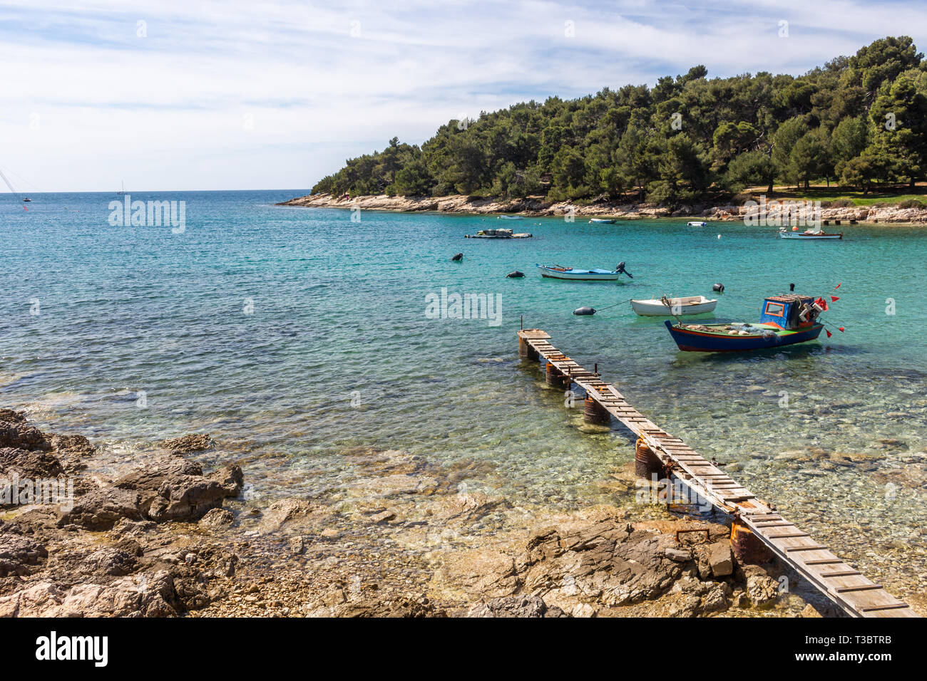Fishing boats parked in a bay with transparent waters in Stoja near ...