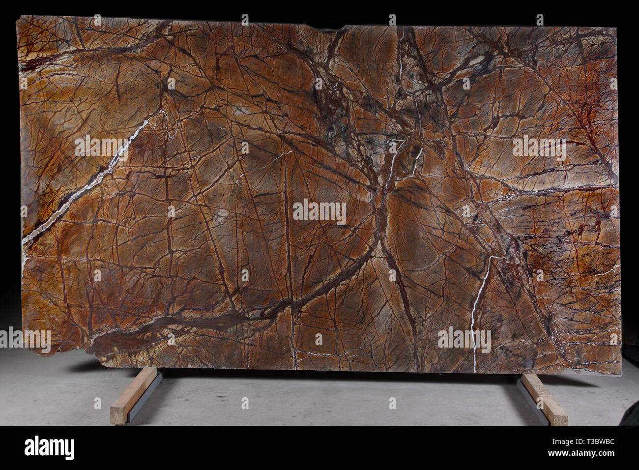 Natural stone brown marble with an interesting pattern is called ...