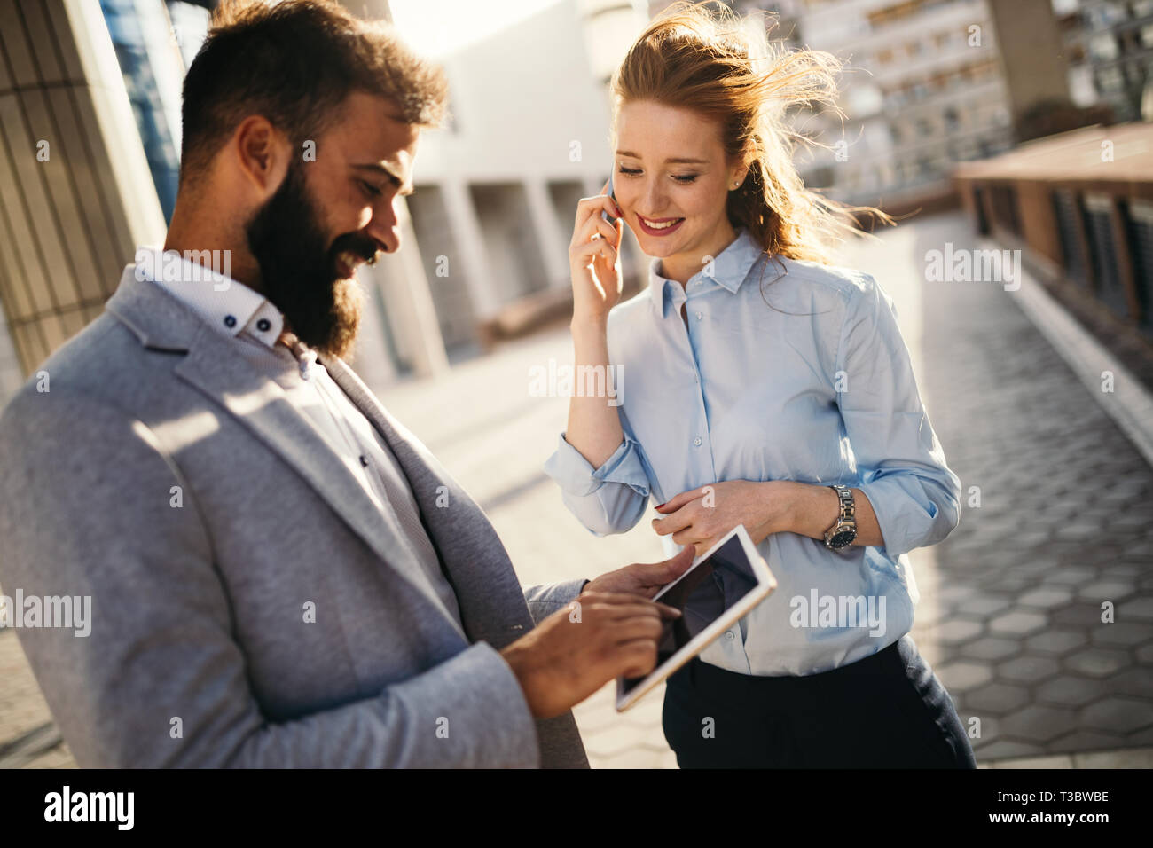 Business people discussing ideas outside Stock Photo - Alamy
