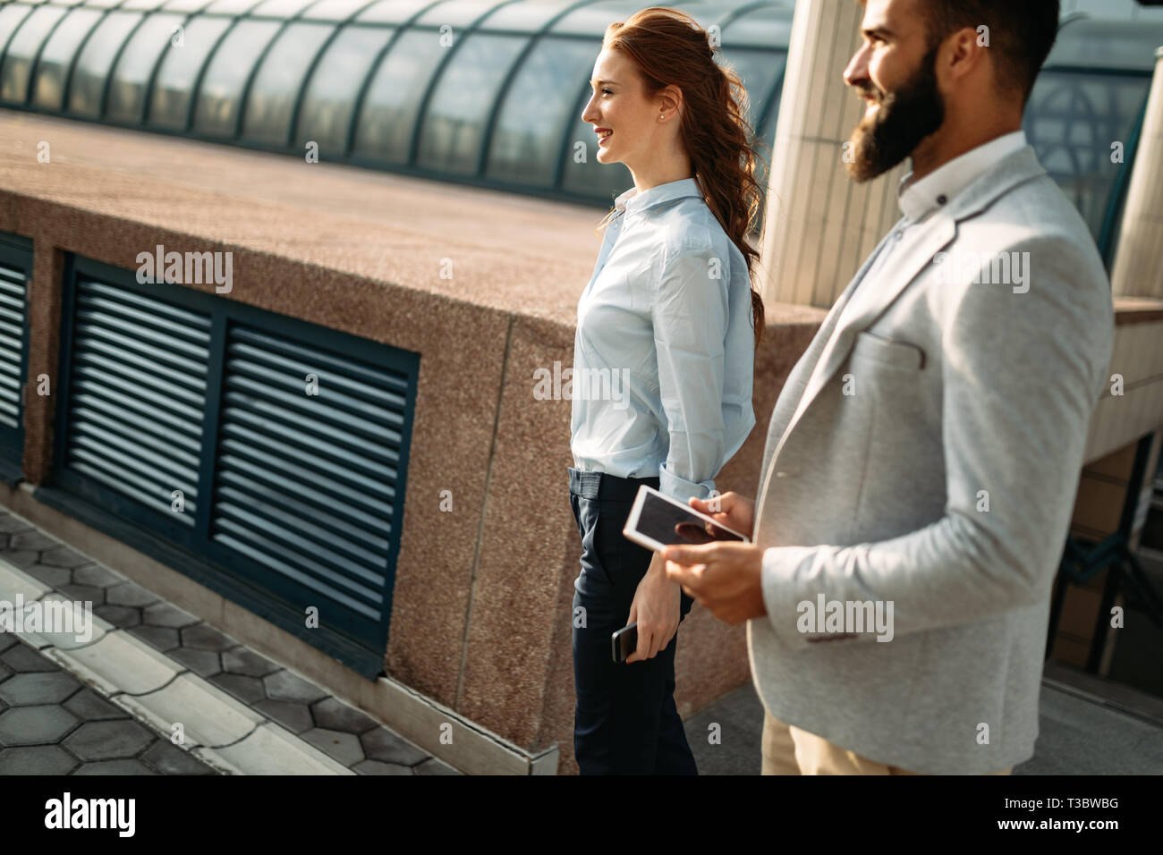 Business people discussing ideas outside Stock Photo - Alamy