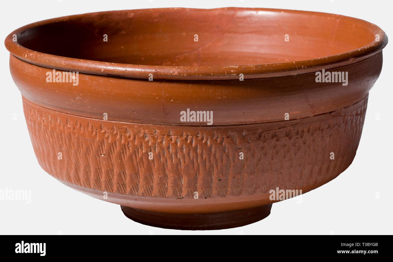 A Roman Terra Sigillata bowl, 3rd century A.D. Wide, offset rim, the ...