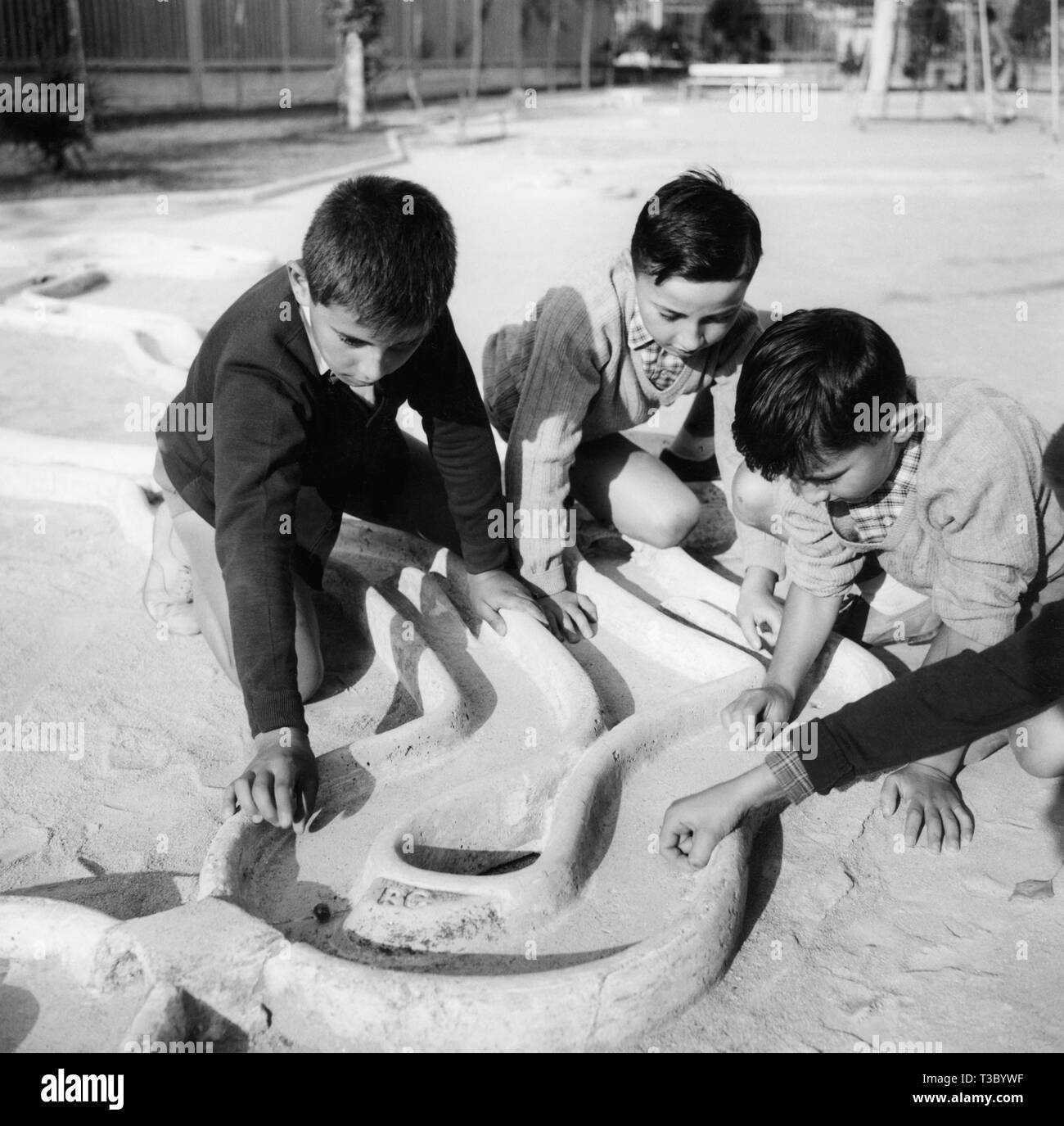 children playing marbles, 1957 Stock Photo - Alamy