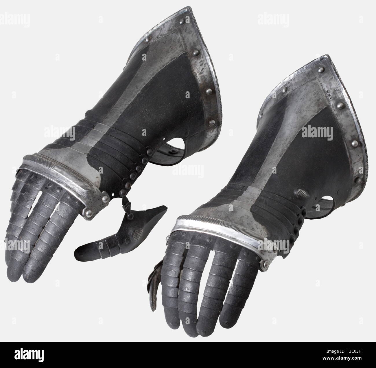 A pair of German black and white fingered gauntlets, circa 1580 ...