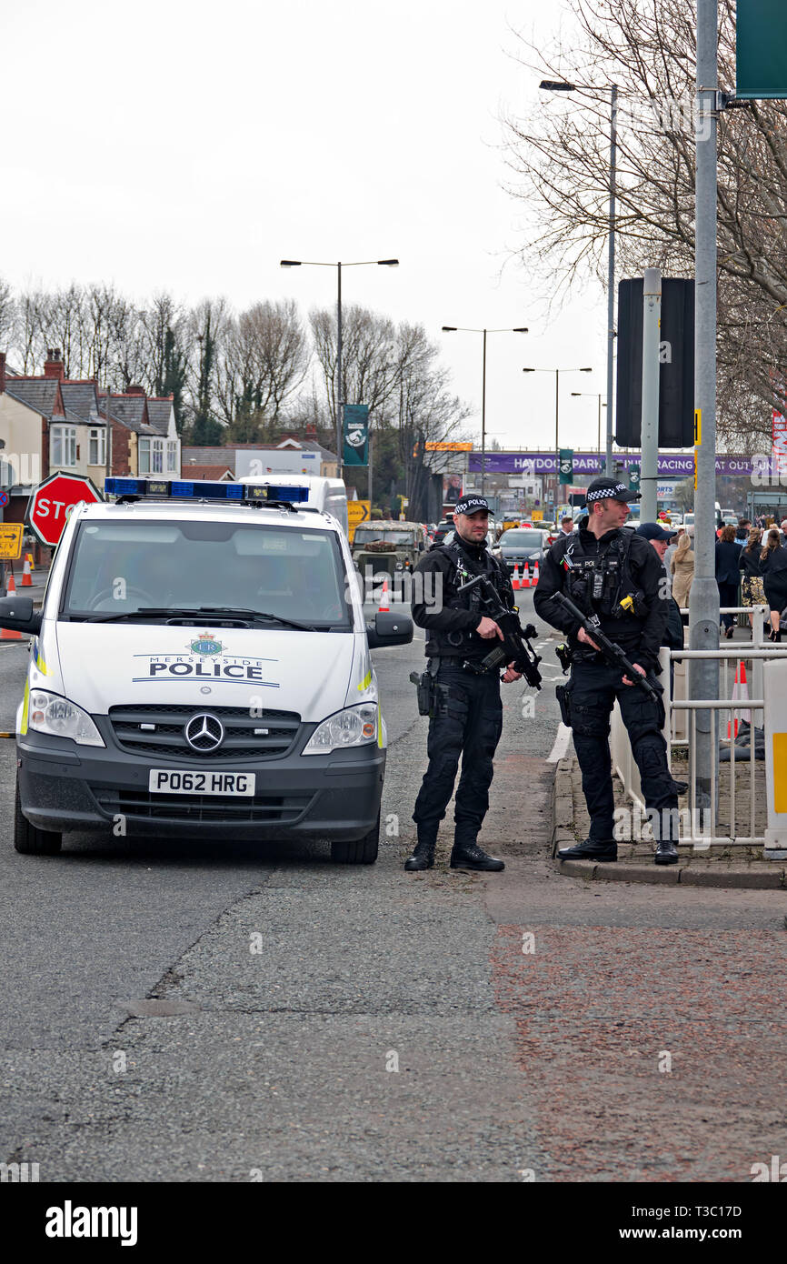 Heavily armed UK police officers on duty at the 2019 Aintree Grand ...