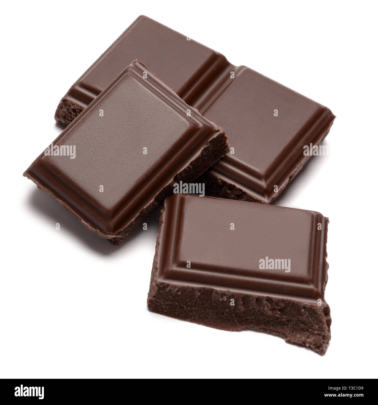 Dark organic chocolate pieces isolated on white background Stock Photo ...