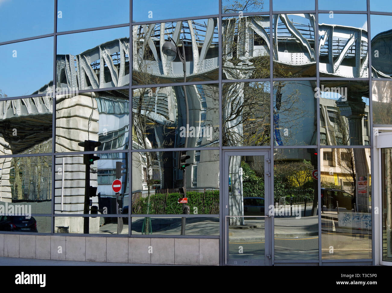 Distorted reflections of iron viaduct with iron & stone columns of the ...