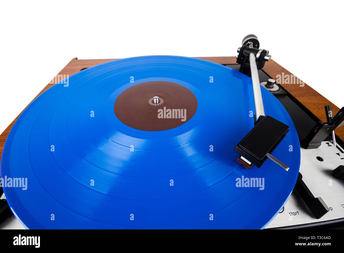 Vintage turntable with a blue vinyl isolated on white. Wooden plinth ...
