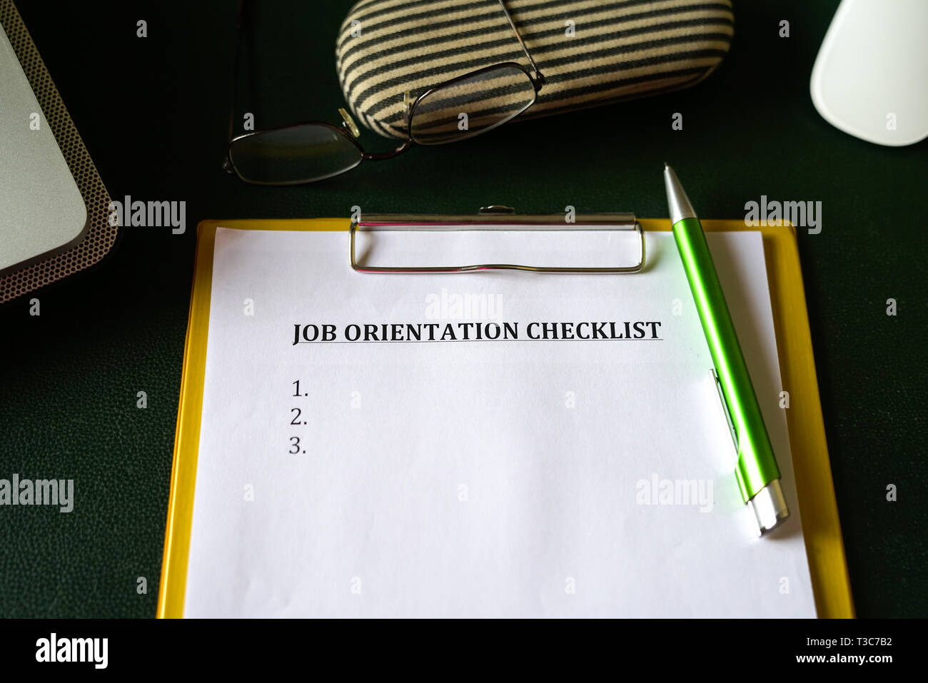 Job orientation checklist on an office desk, an onboarding concept ...