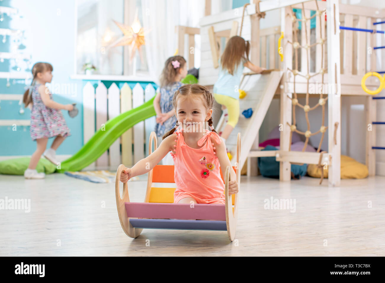 Happy little children have fun in playroom Stock Photo - Alamy