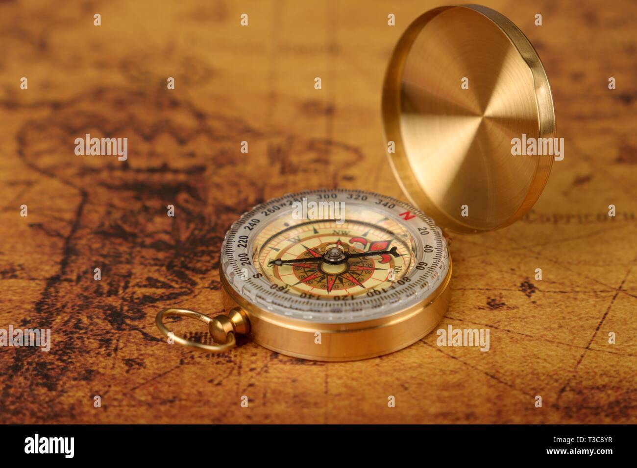 Ancient compass on map old hi-res stock photography and images - Alamy