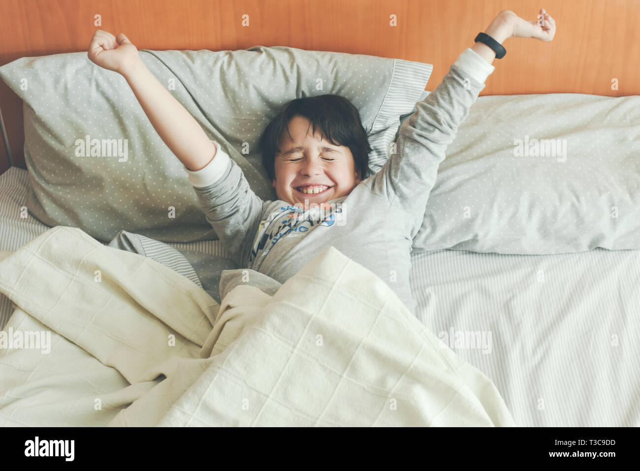 Boy Waking Up From Bed