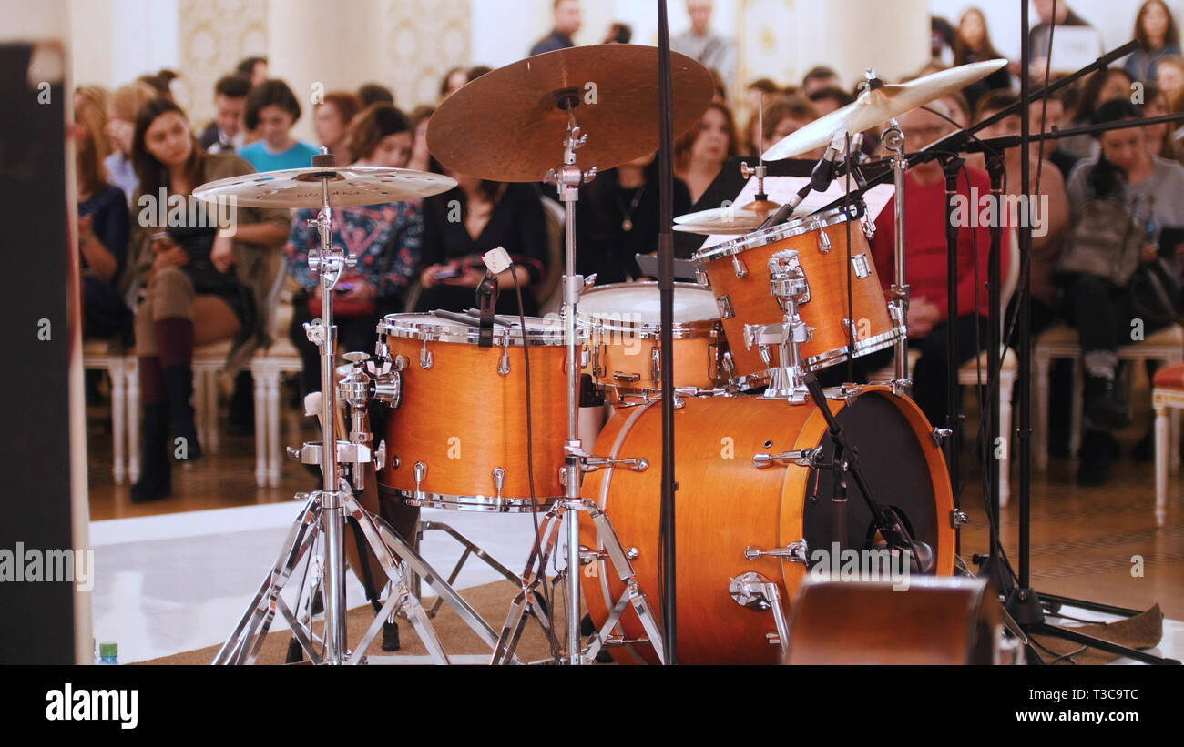 A jazz concert in the concert hall. Drum kit and audience on a ...